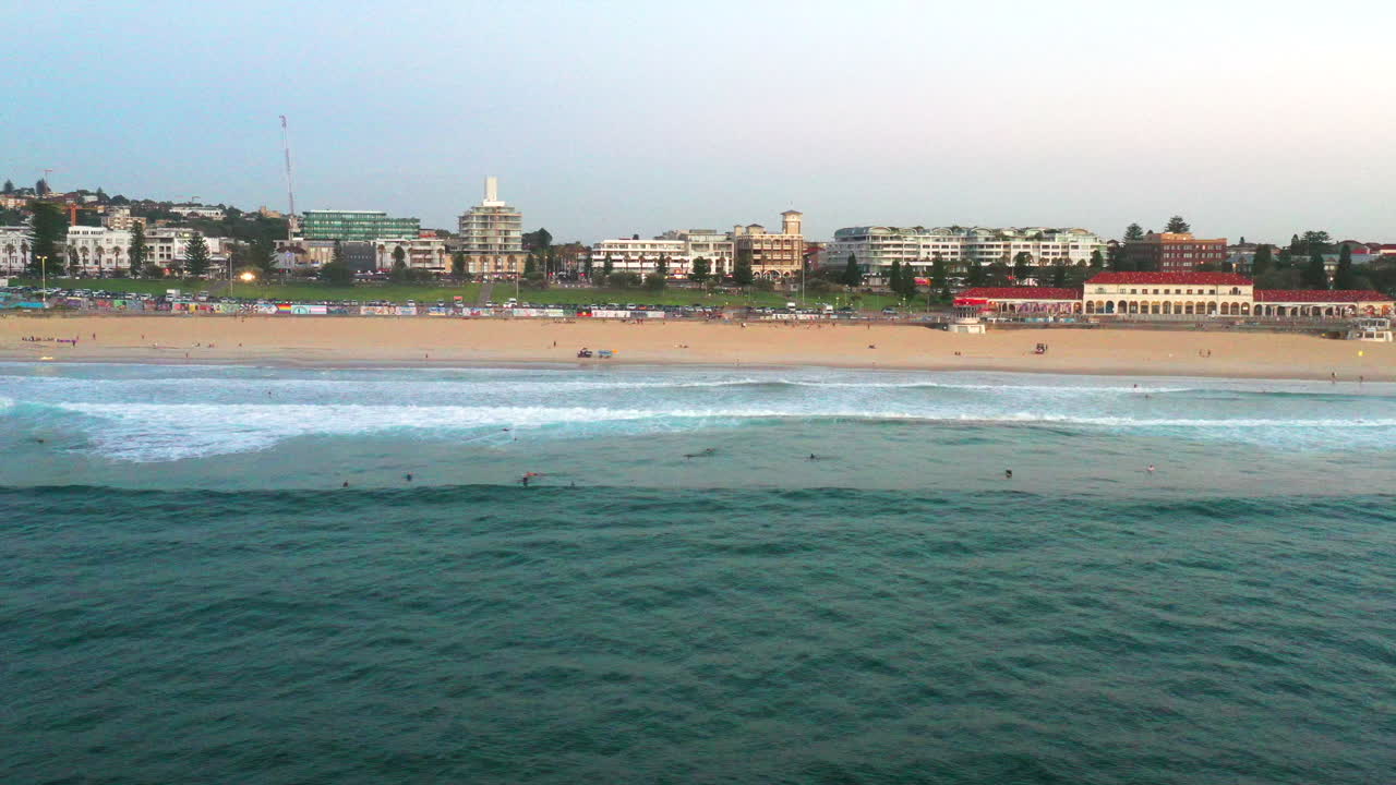 Drone Tracking Left Along Bondi Beach With Surfers In The Water And ...