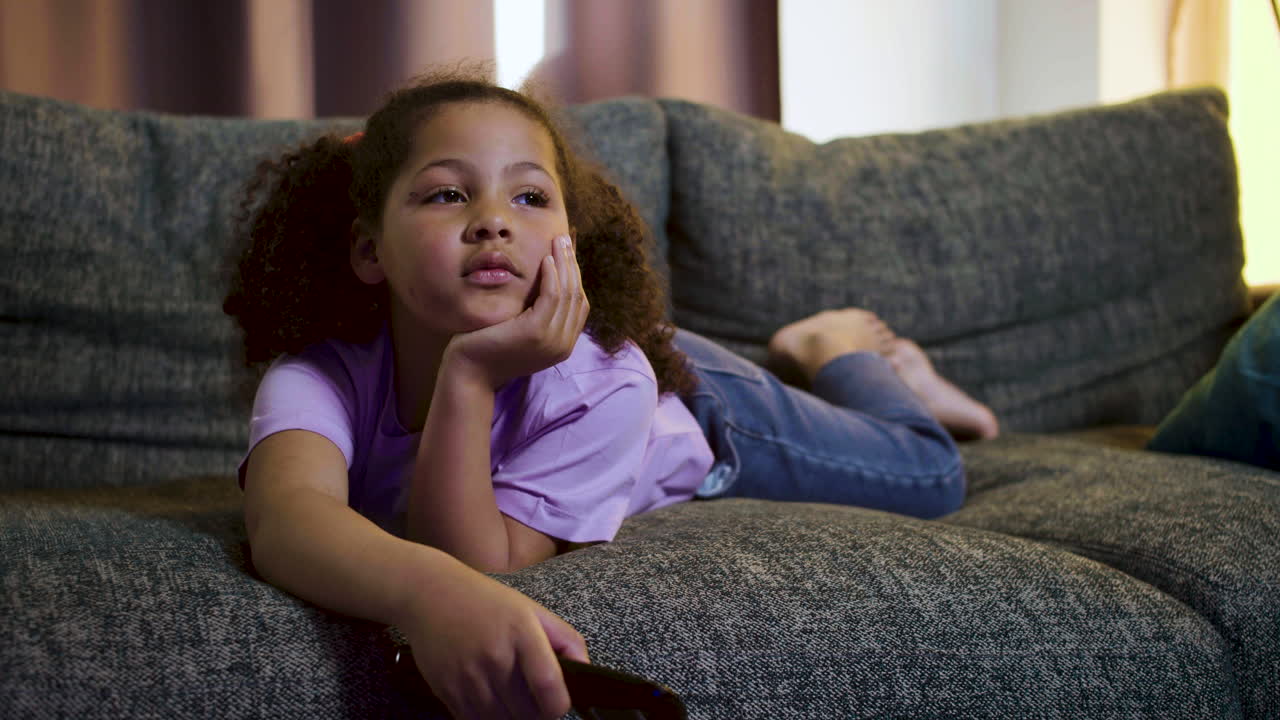 Free stock video - Kid watching film at home