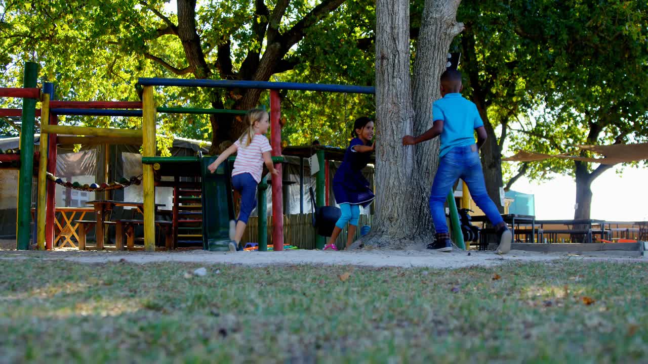 Premium stock video - Kids playing in the playground 4k