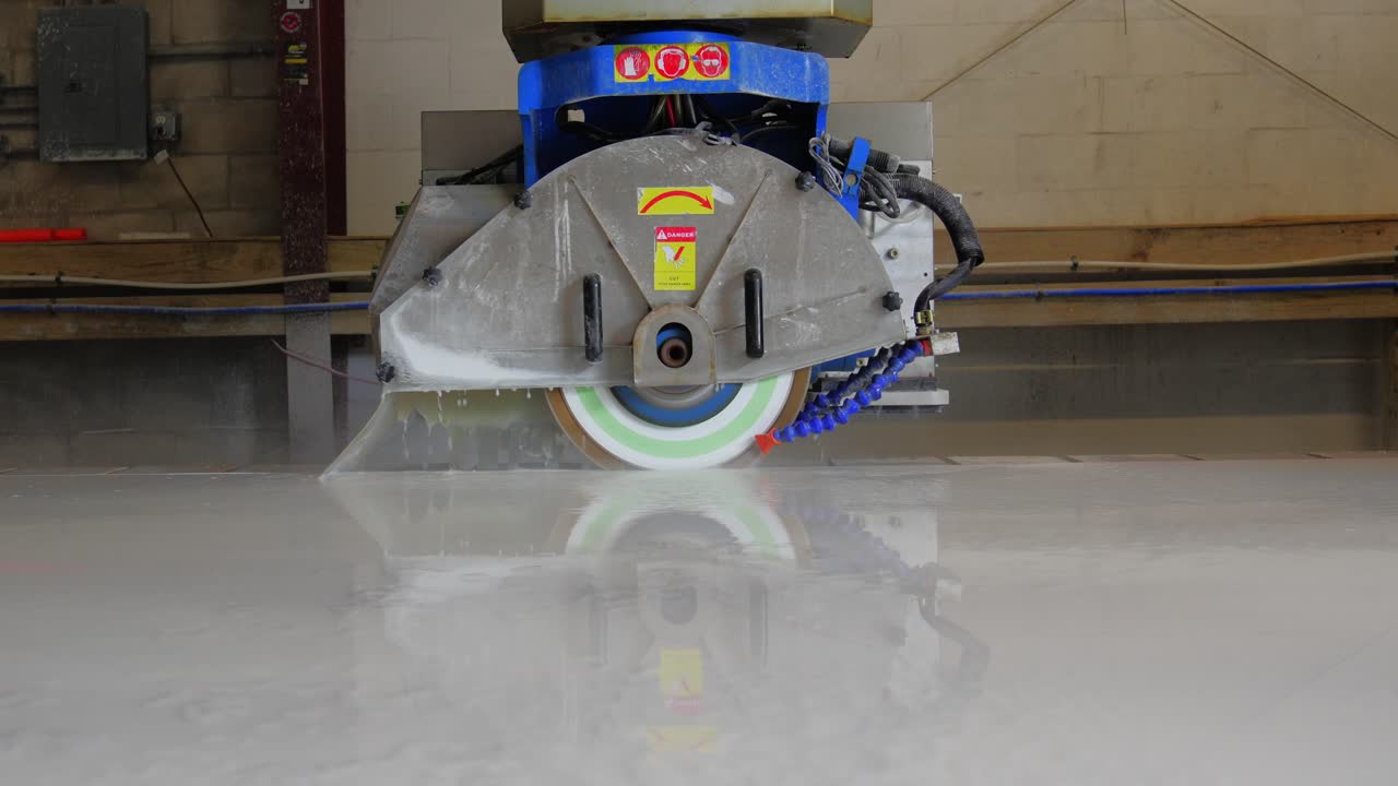Premium stock video - Automatic saw granite cutting machine cutting ...