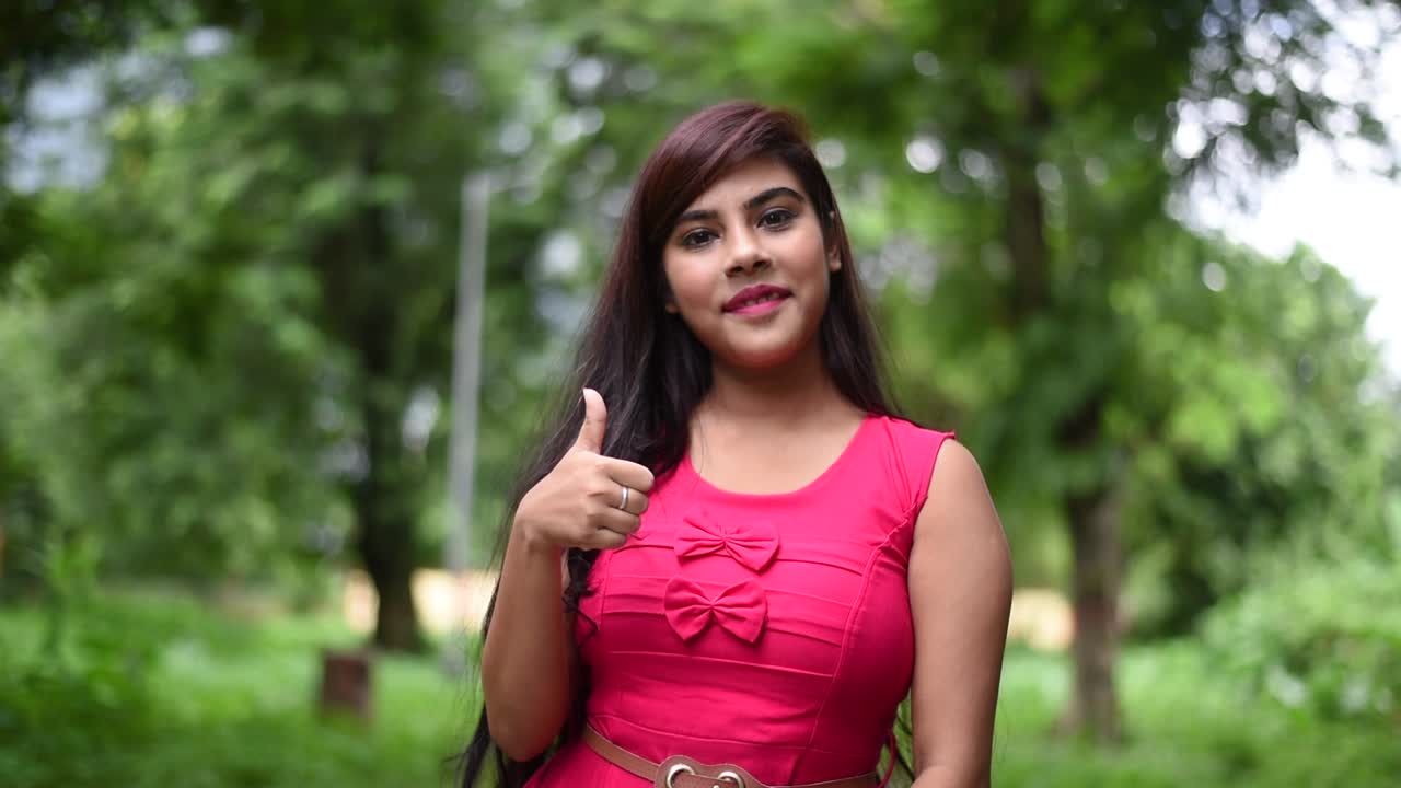 A Beautiful Girl Approves And Agrees To Something By Showing Thumbs Up ...