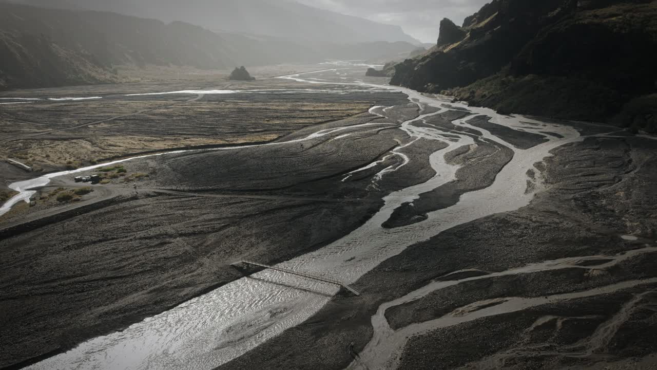 Cinematic Aerial Thor Valley, Glacial River Flowing Through Black ...