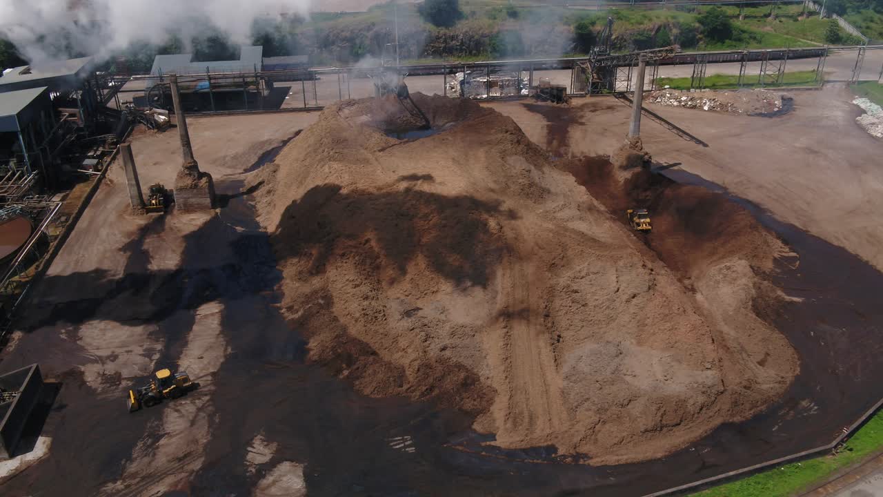 Premium stock video - Bagasse tailings pile at a paper and tissue ...