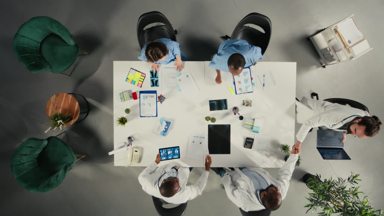 Vertical Video Top down view of doctors and nurses in meeting ...