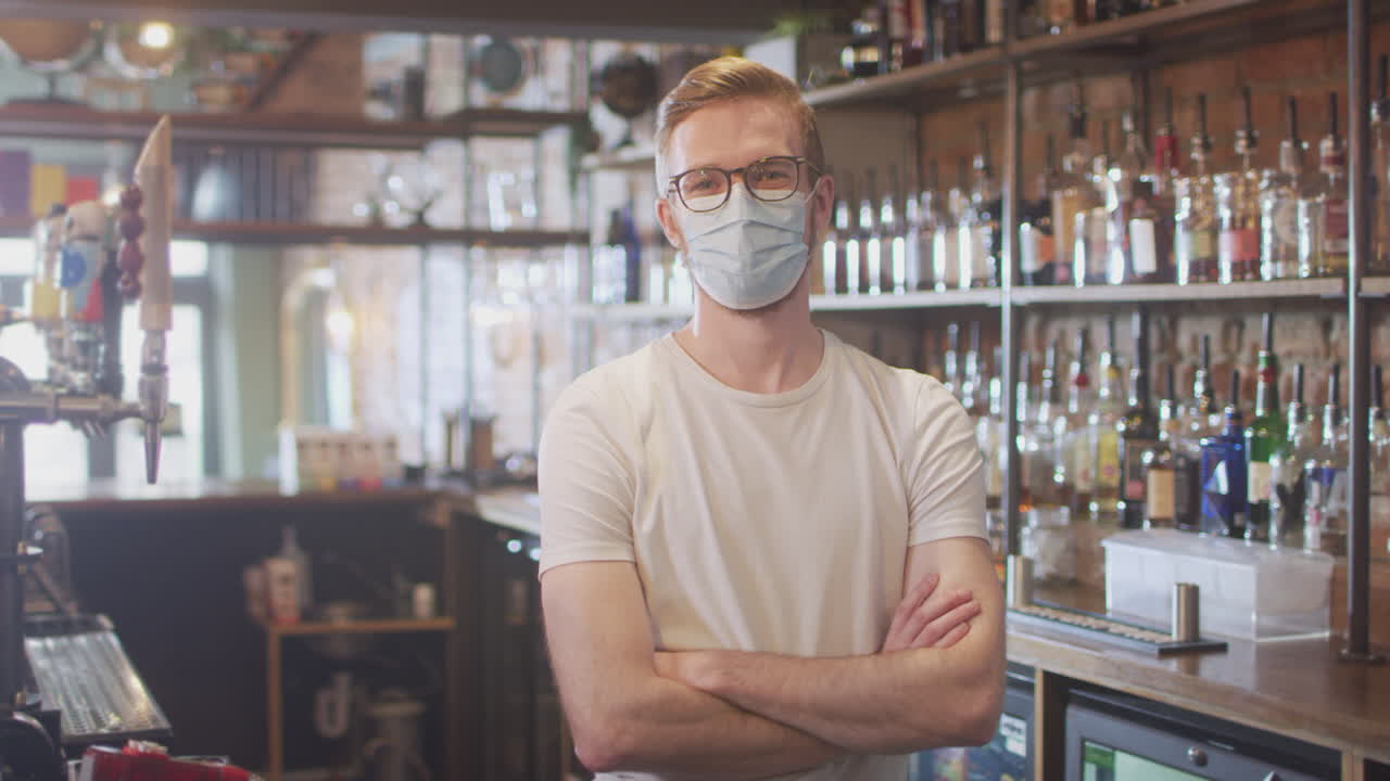 Portrait Of Male Bar Worker Wearing Face Mask During Health Pandemic ...