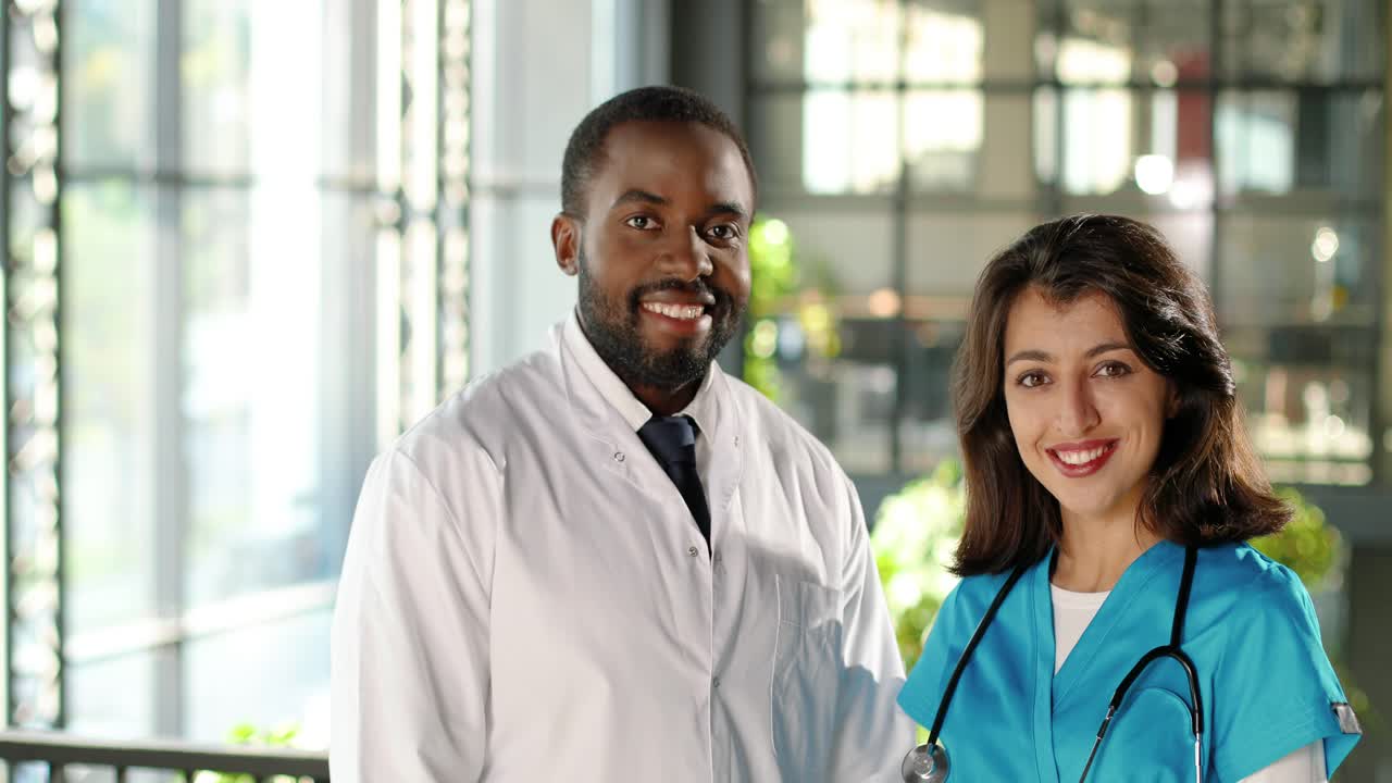 Free stock video - Portrait of mixed-race male and female doctors in ...