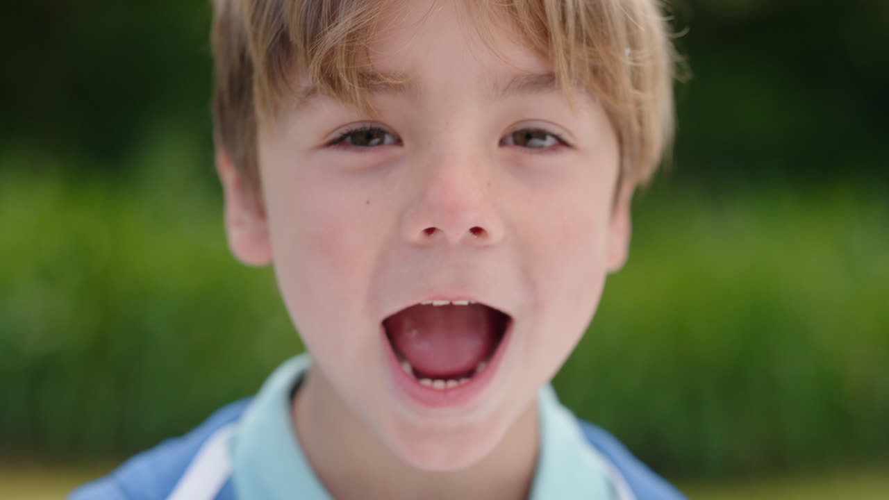 Premium stock video - Portrait cute little boy making faces having fun ...