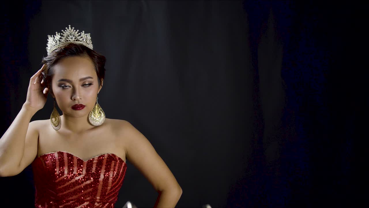 Beauty Pageant Winner Looks At The Camera As She Wears Her Royal ...