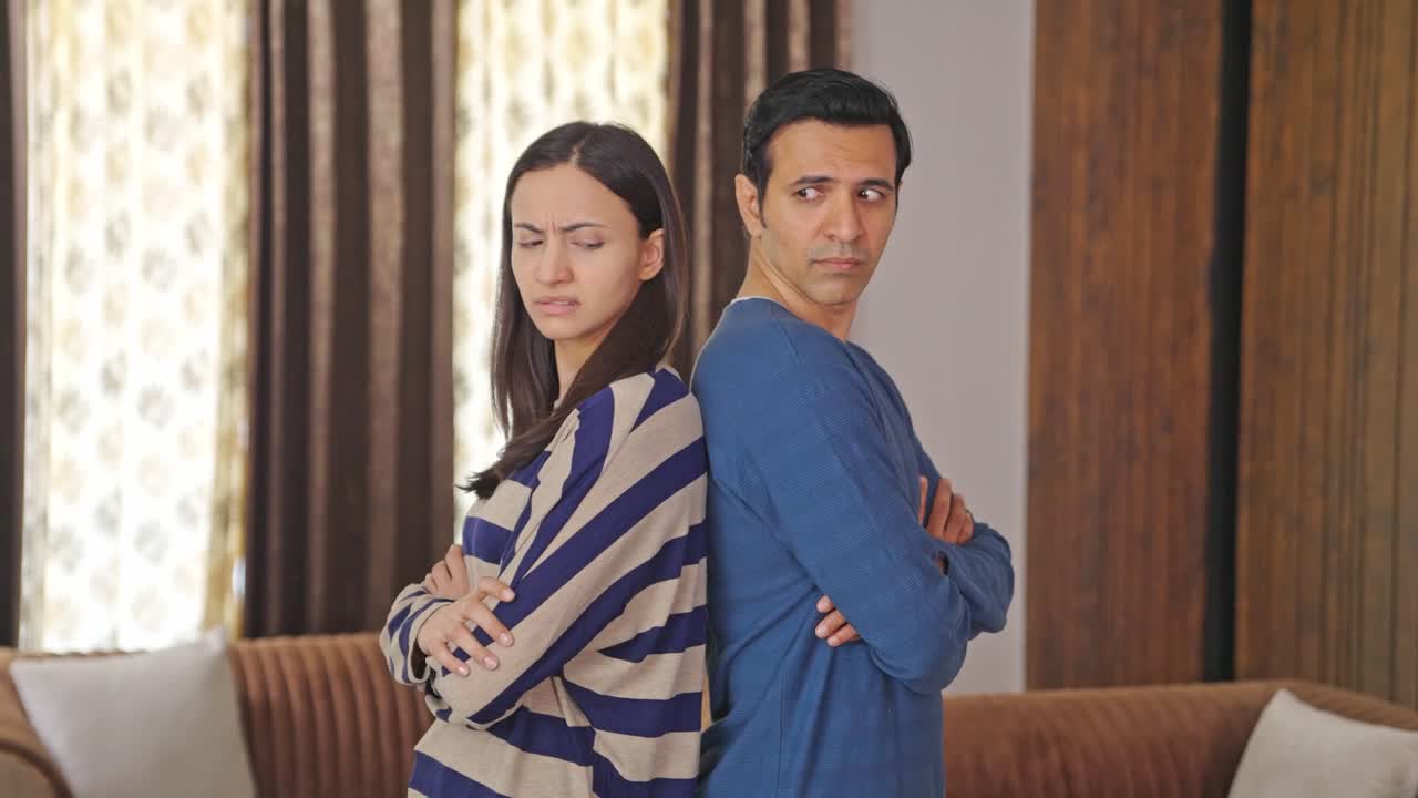 Premium stock video - Angry indian couple not looking at each other