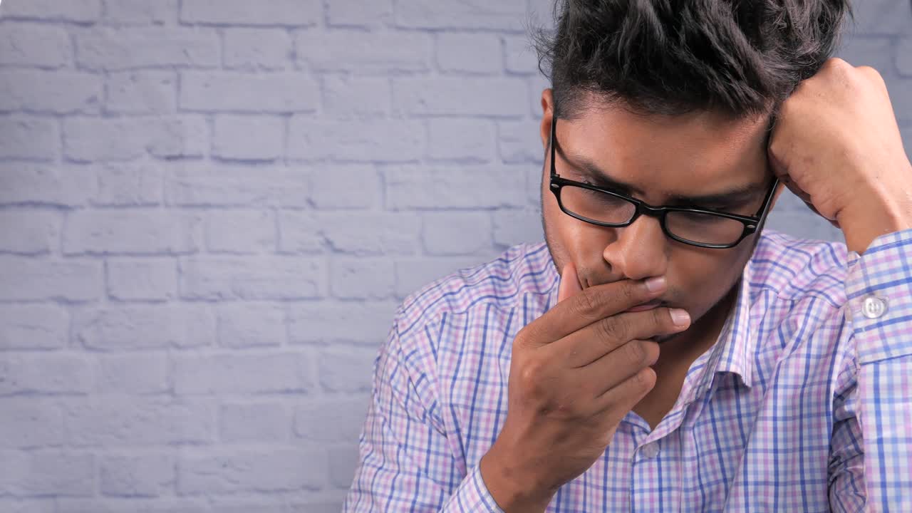 Young Man Thinking or Stressed | Premium Stock Video Footage