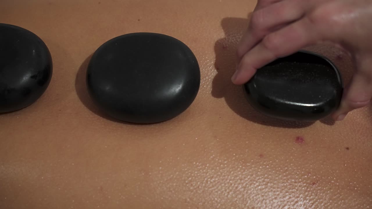 Premium stock video - Stone massage therapy is a luxurious wellness ...
