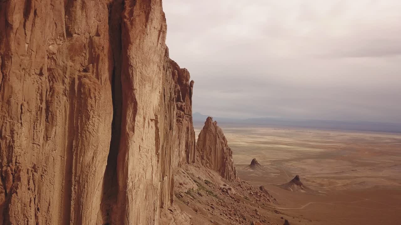 Premium stock video - Drone shot flying close to shiprock looking over ...