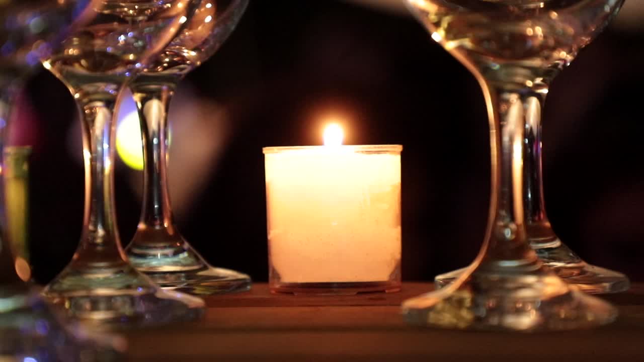 Premium stock video - Candle burning at night