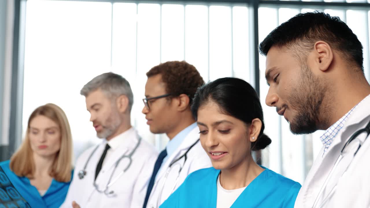Free stock video - Multi ethnic doctors, men and women, talking and ...