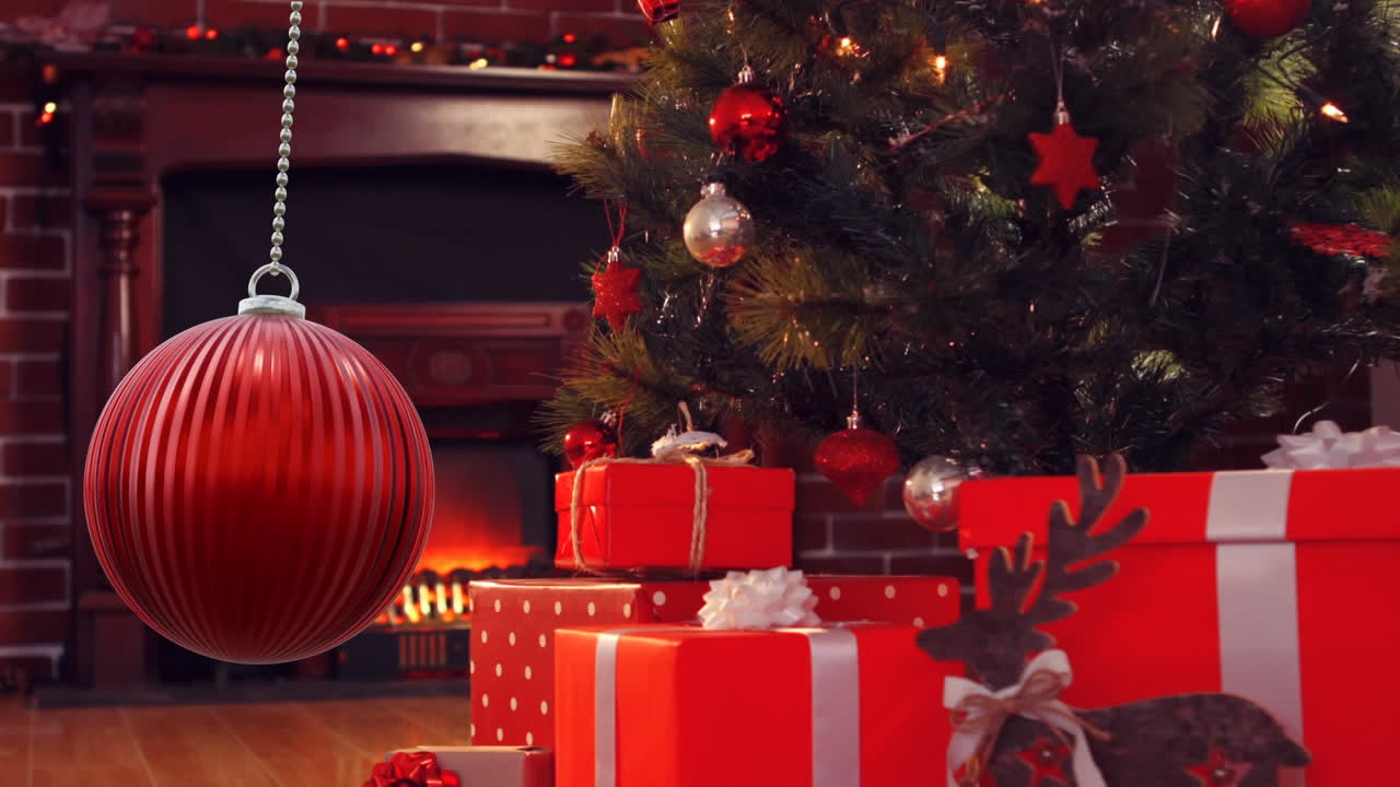 Premium stock video - Animation of christmas bauble over christmas tree ...