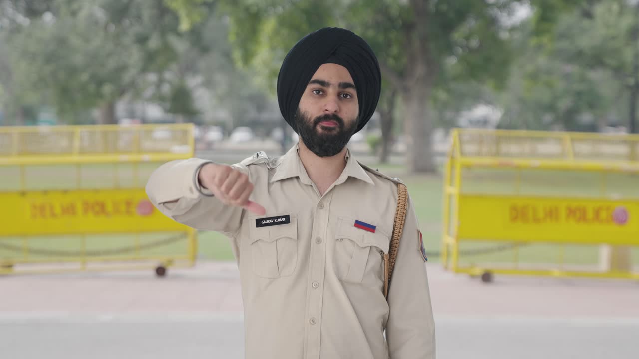 Premium stock video - Disappointed sikh police indian man showing ...