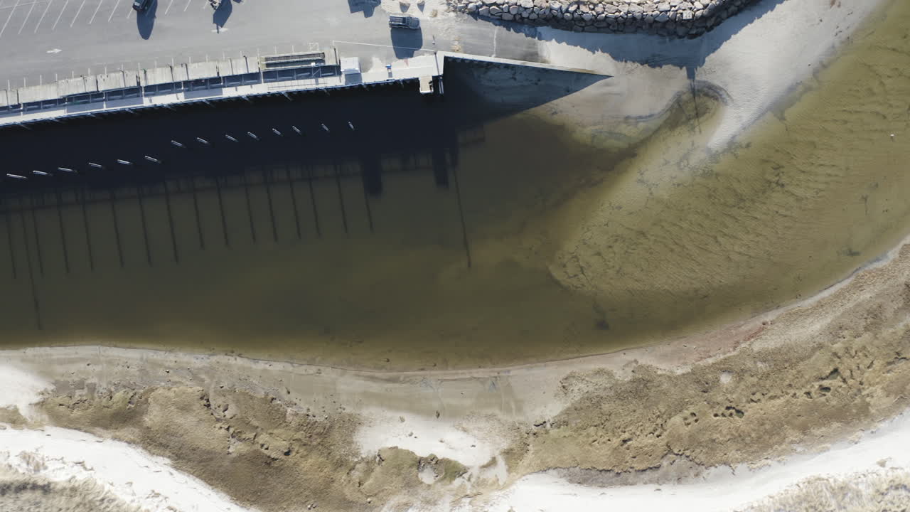 The camera looks down and gives a birds eye view of Rock Harbor ...