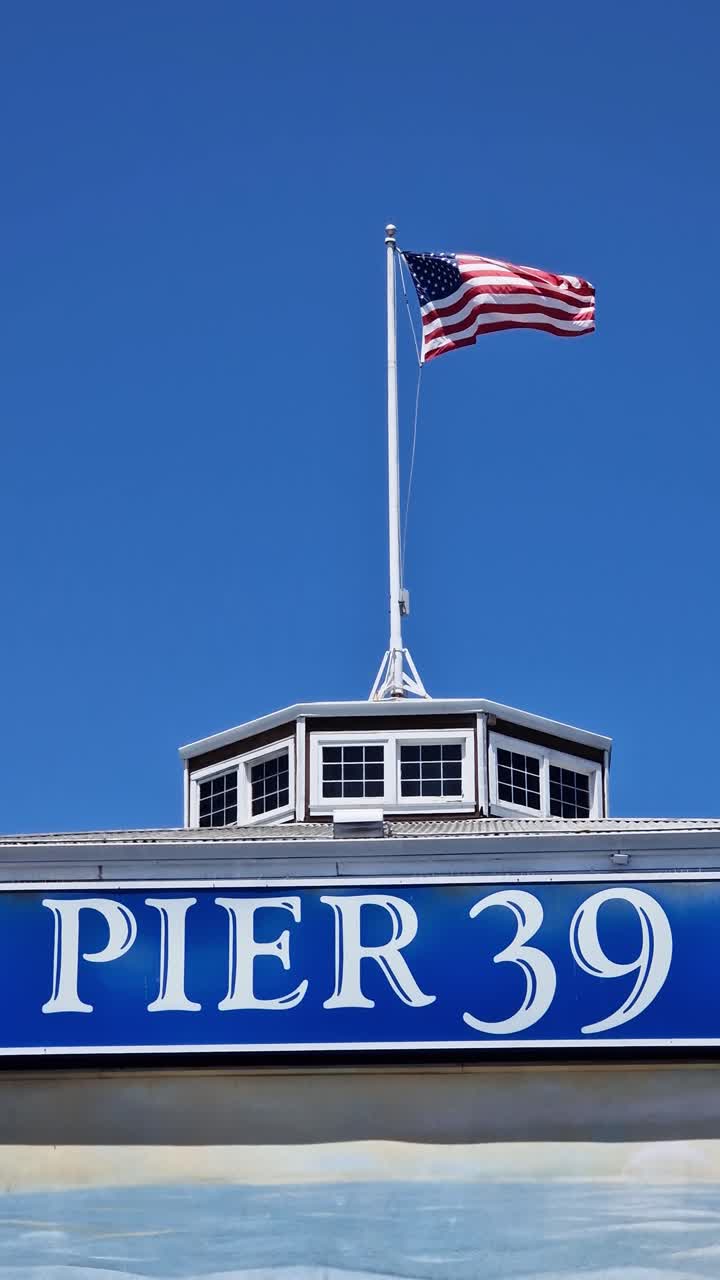 Pier 39 Sign and American Flag. Vertical View. San Francisco ...