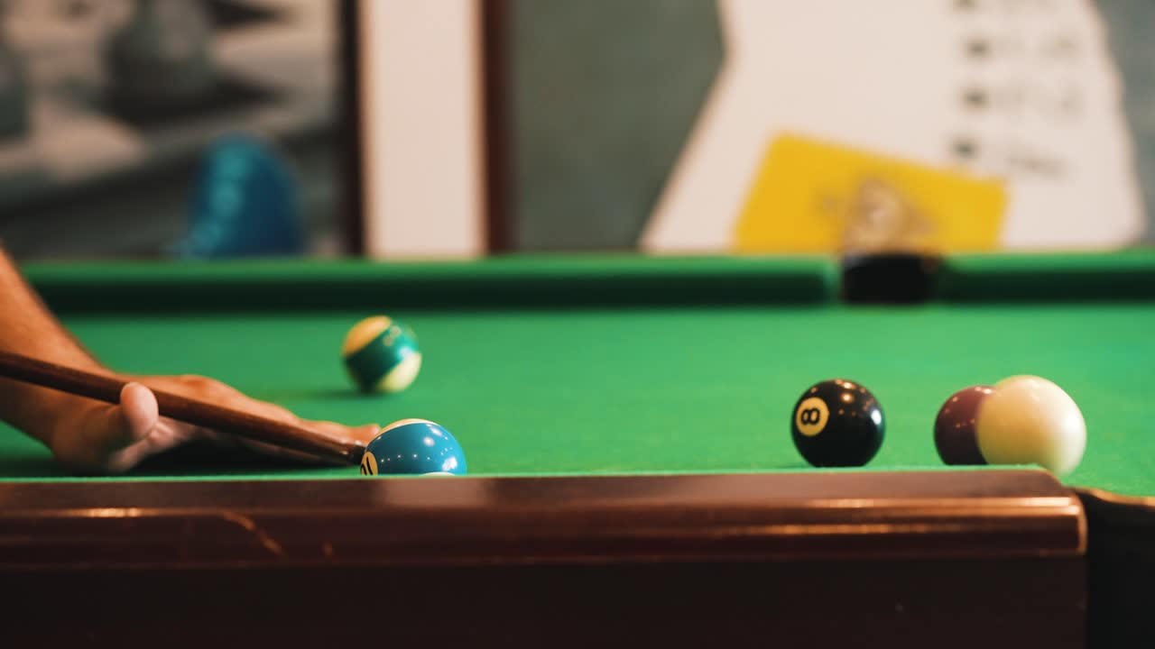 Premium stock video - Billiard player triyng to trick jump shot and miss