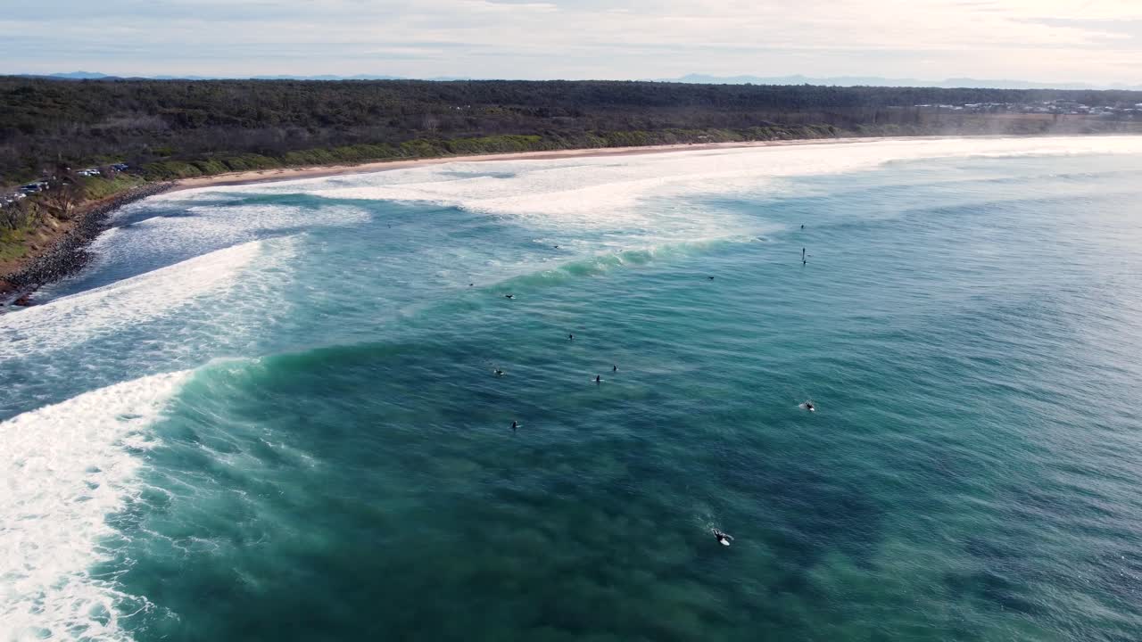 Drone Aerial Pan Landscape Scenery Shot Of Surfers In Line-up Ocean ...