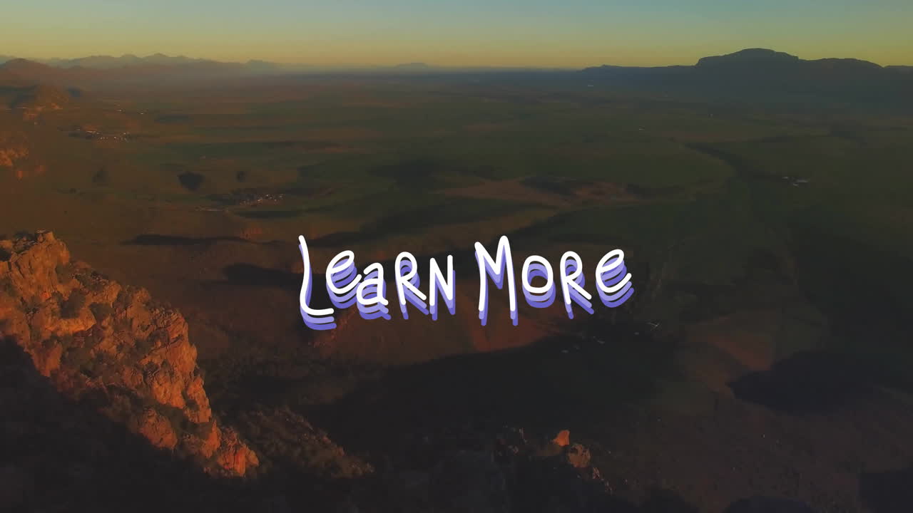 Premium stock video - Animation of learn more text over landscape