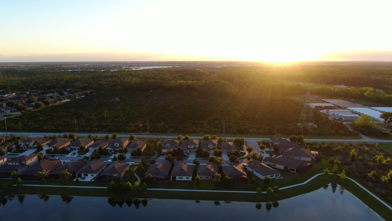 Flying Out Over Lakeside Homes And Farms During A Beautiful Florida ...