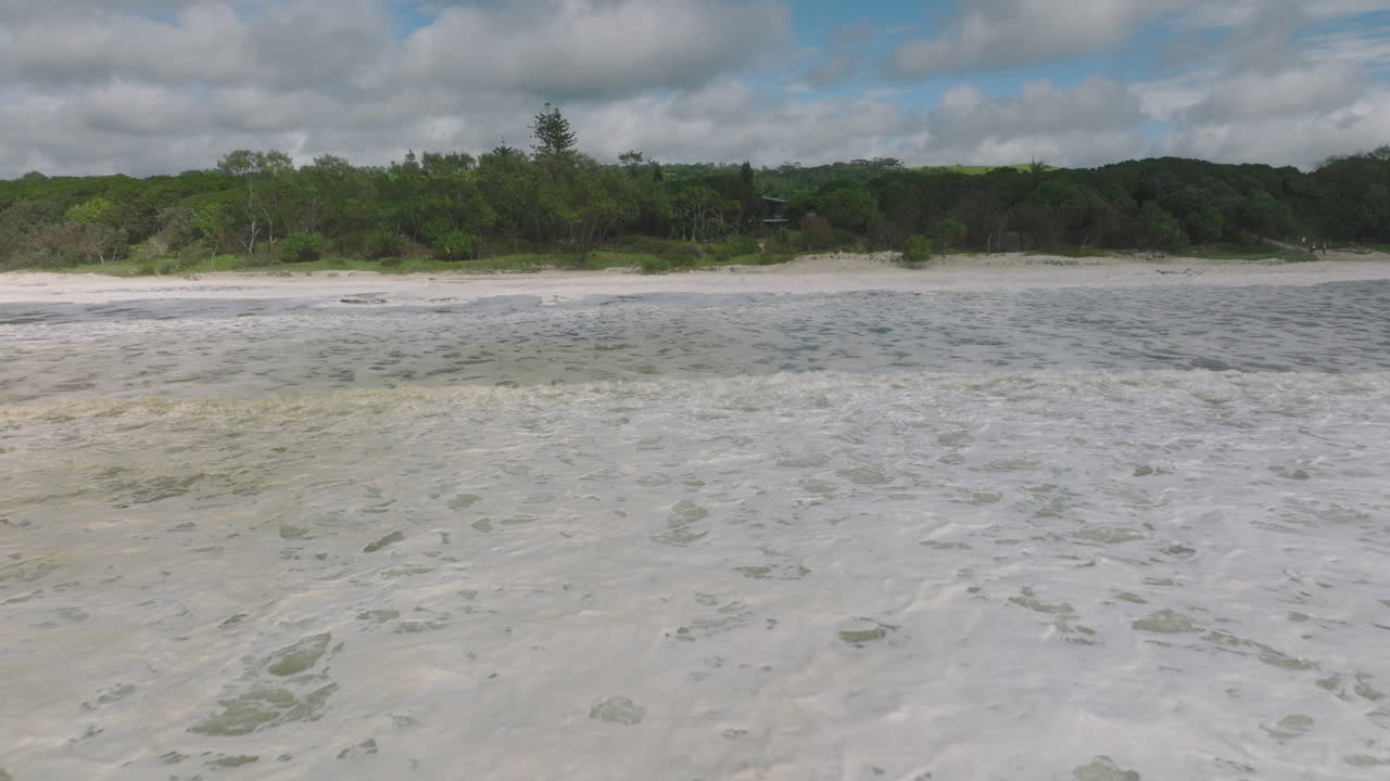 4K Push In And Tildt Down Aerial Of Australian Beach With Sea Foam ...