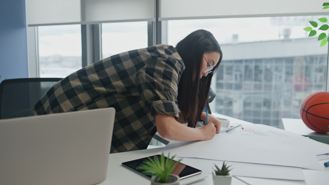 Eyeglasses Architect Drawing Blueprints At Windows Workplace. Woman ...