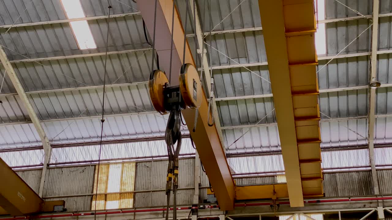 Premium stock video - Yellow overhead crane on the factory