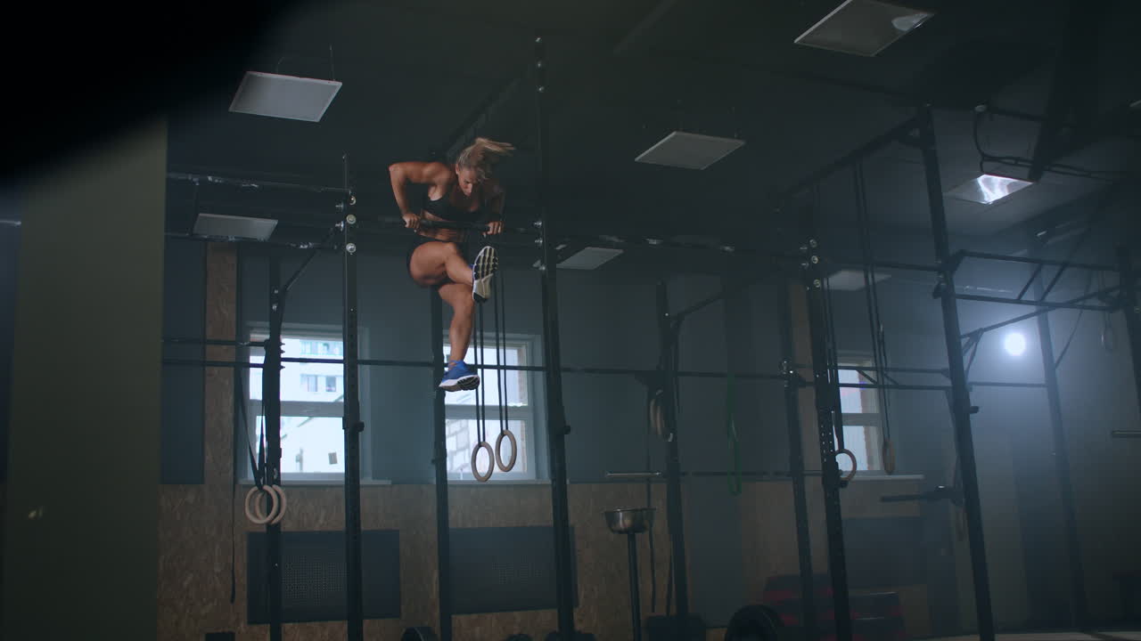 Beautiful Strong Woman Doing Pull-Ups In The Hardcore Gym. Gorgeous Professional Female Athlete ...