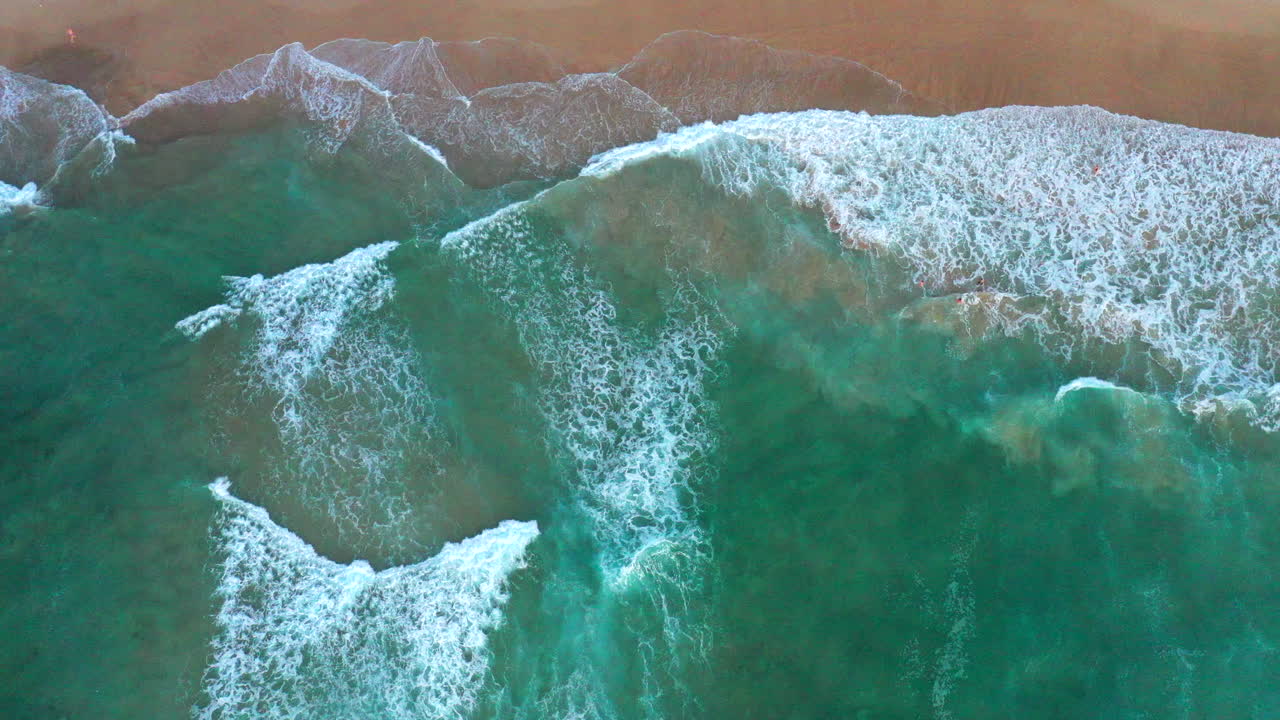 Ascending Aerial Top Down Drone Shot Of The Beach And Ocean Riptide ...
