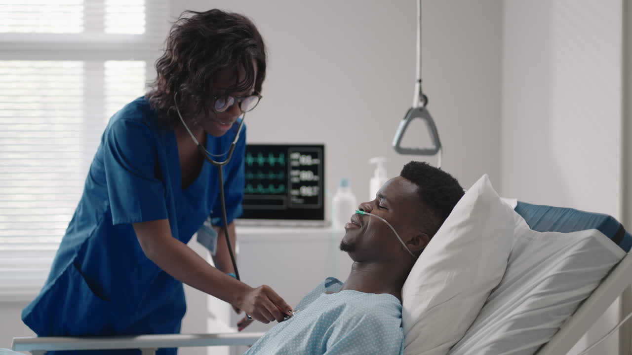 Premium stock video - A black female doctor is talking to a black male ...