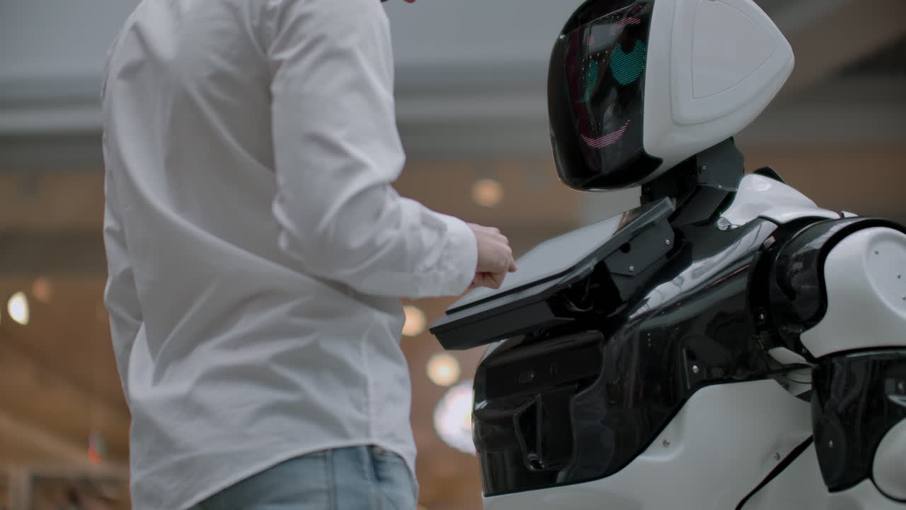 Electronics Engineer Working Scientist Inventor On Robot Construction. Slow-motion. Modern ...