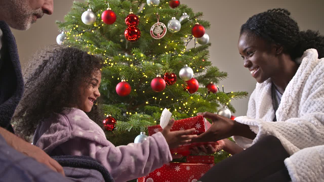 Mother giving child christmas present Free Stock Video Footage