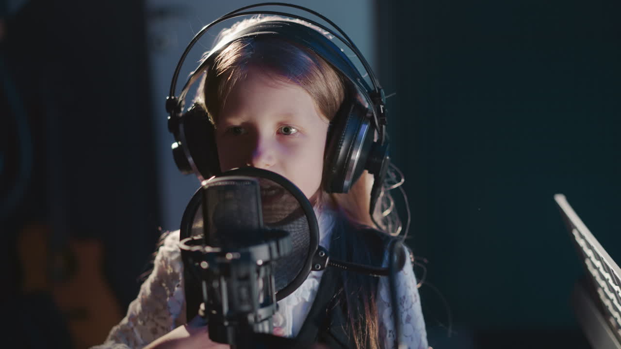Young singer gestures while performing closeup. child captures rhythm ...