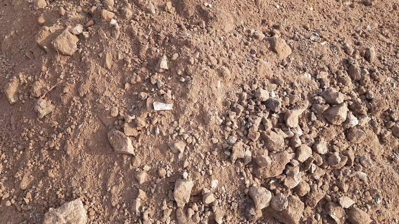 A huge pile of piles is kept at the construction site - moorum - murum ...