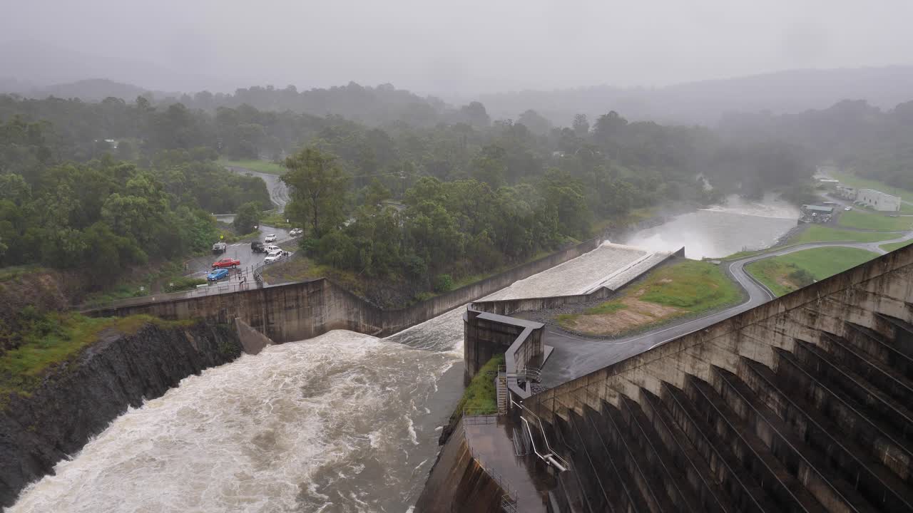 Top View And Handheld Shot Of Hinze Dam Under Heavy Rain And Water ...