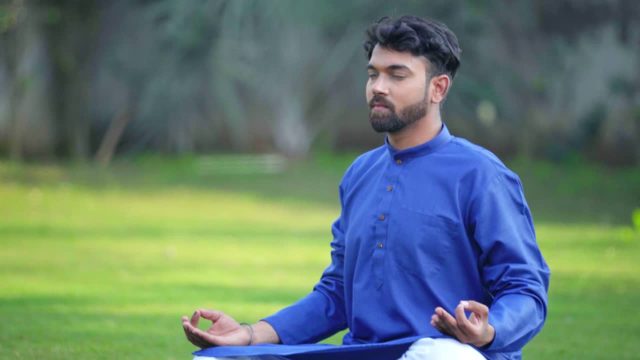 Premium stock video - Indian man doing meditation and yoga