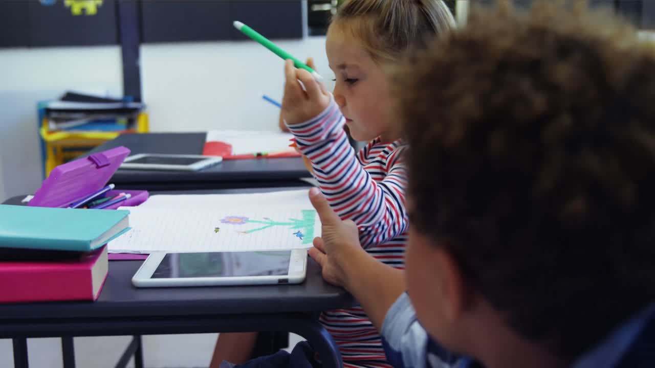 Premium stock video - Schoolboy borrowing color pencil from his classmate