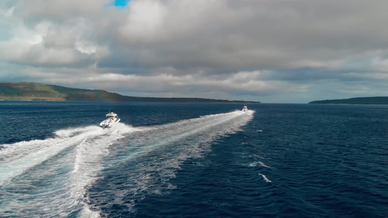 Dramatic aerial view on two speedboats sailing in tropical sea by ...