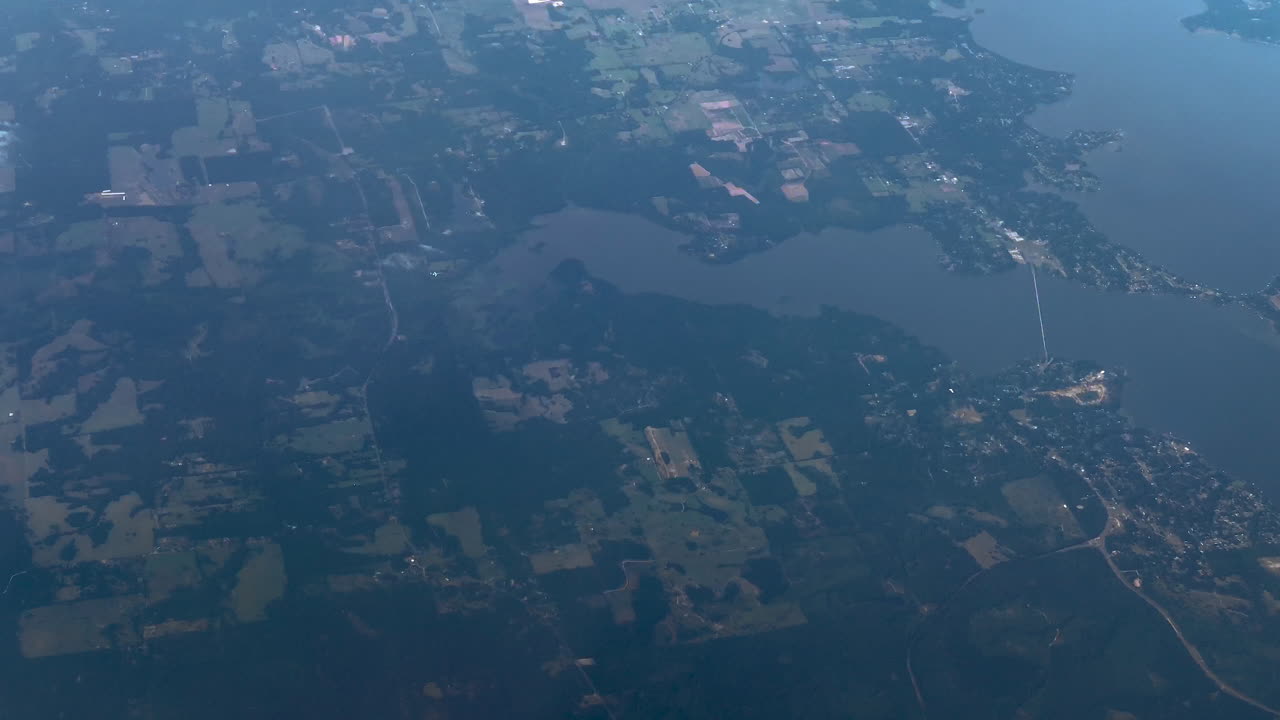 View of a plane flying from above Premium Stock Video Footage