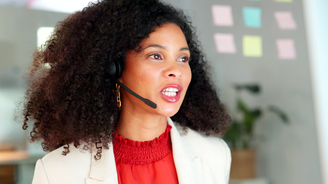 Premium stock video - Call center agent talking to clients while wearing