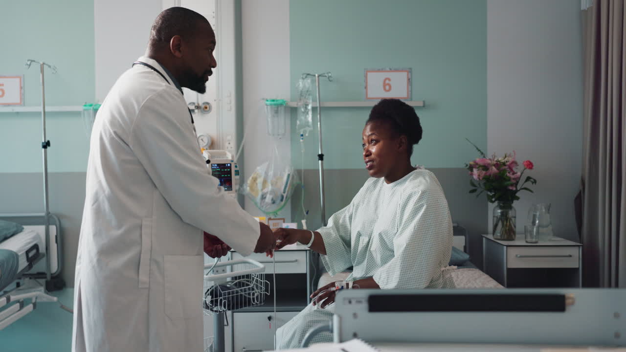 Patient, doctor and consultation on bed Premium Stock Video Footage