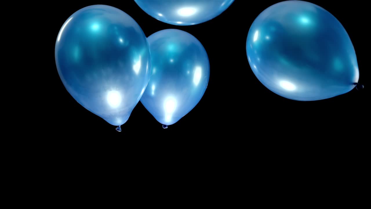 A collection of blue balloons slowly falling in smooth motion, captured ...