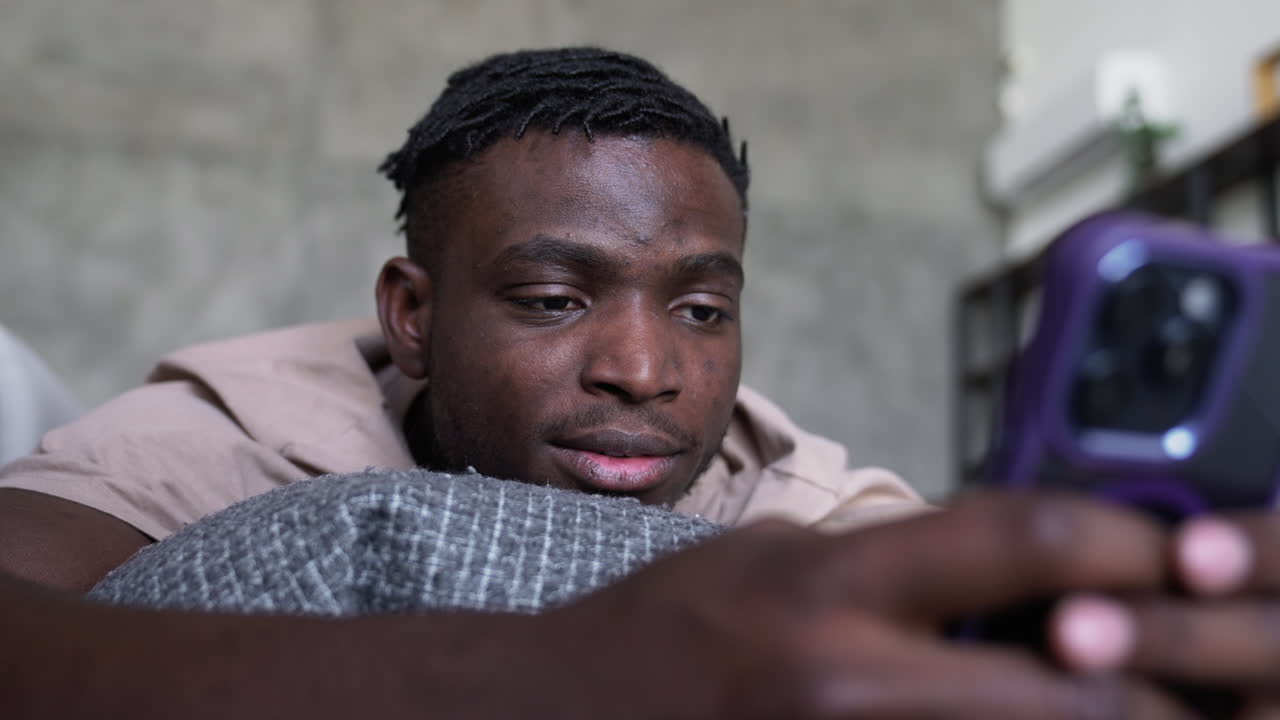 Free stock video - Man using phone at home