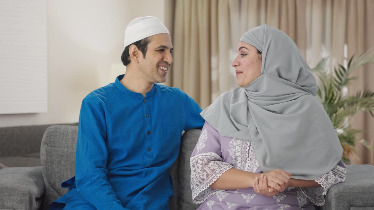 Happy muslim couple talking to each other Premium Stock Video Footage