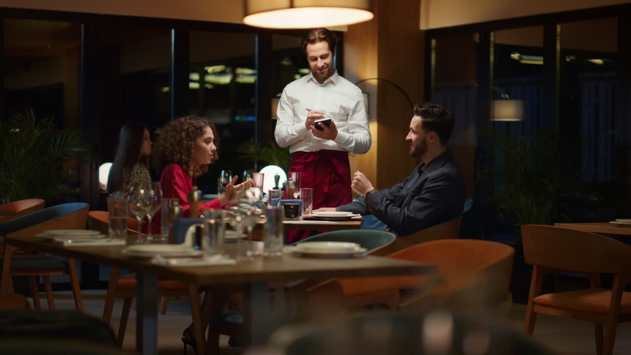 Premium stock video - Restaurant waiter taking order serving romantic ...