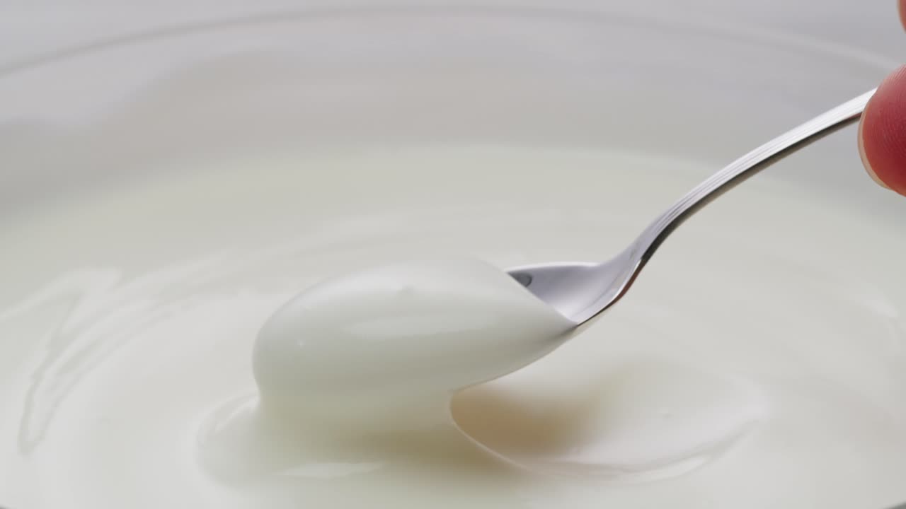 Mixing Yogurt with a Spoon | Premium Stock Video Footage