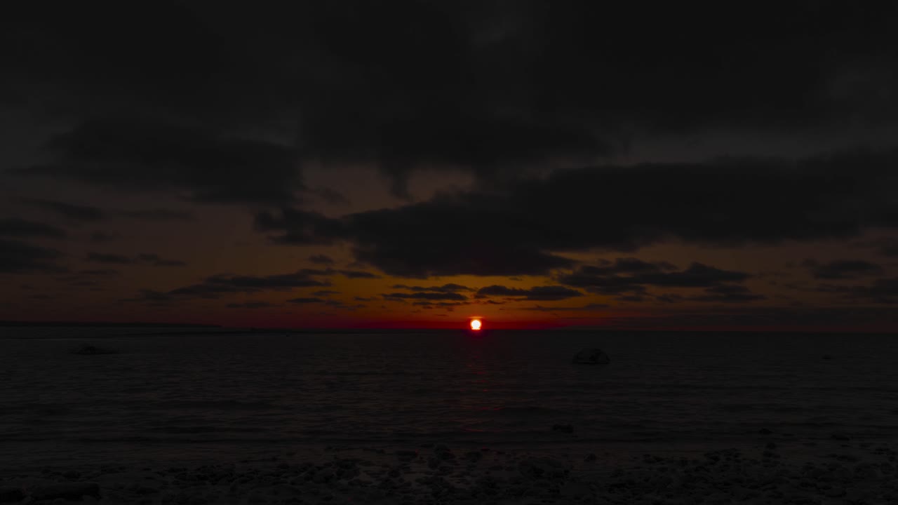 Premium stock video - Sunset over calm a lake at port elgin with clouds ...