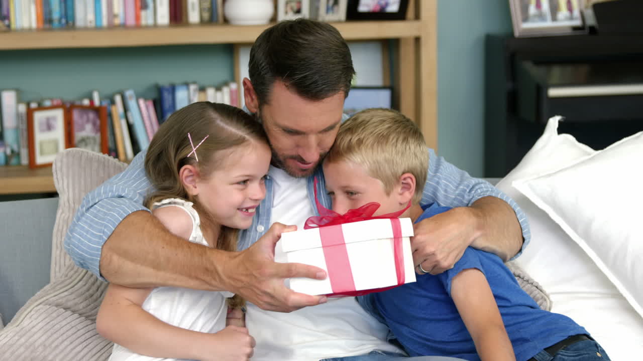 Father receiving gift from his children | Premium Stock Video Footage